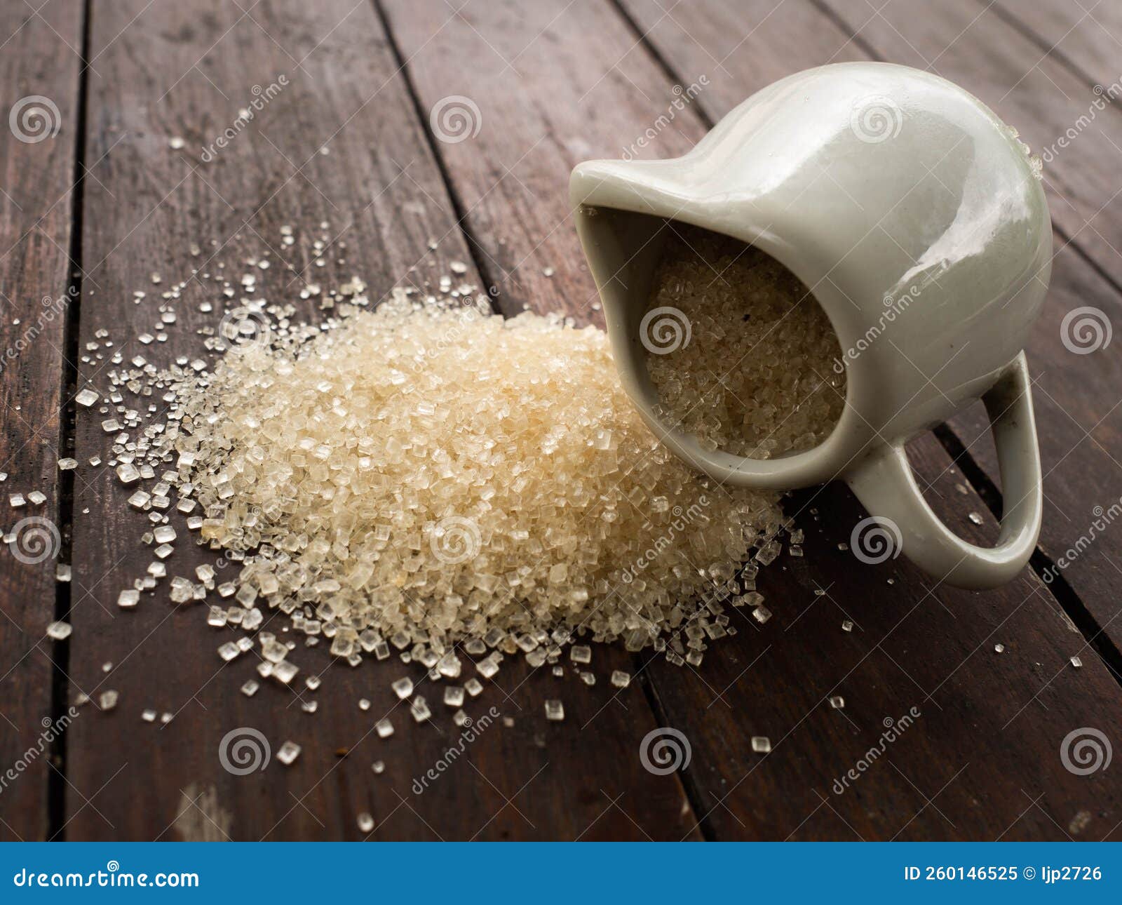 Picture of Sugar that Spilled from a White Ceramic Container on a ...