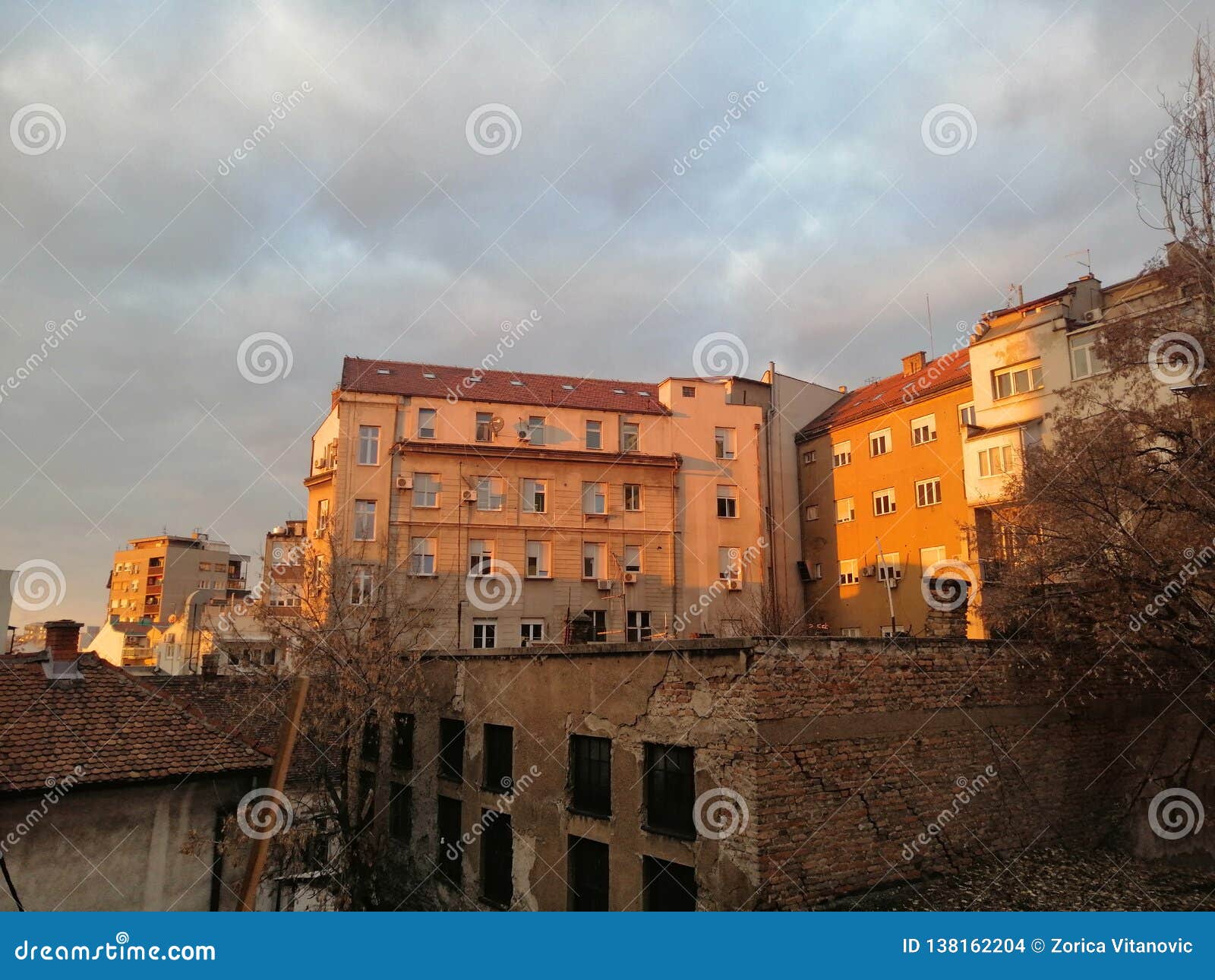 Sunny building stock photo. Image of cloud, sunset, building - 138162204