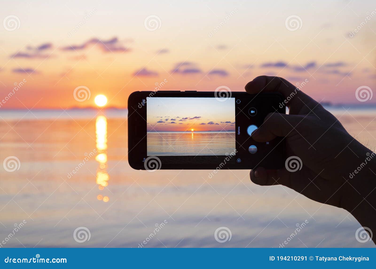 Picture of Sunset Over the Sea on the Cellphone Stock Image - Image of ...