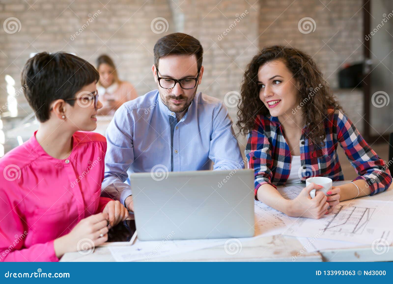 Picture of Young Architects Discussing in Office Stock Image - Image of ...