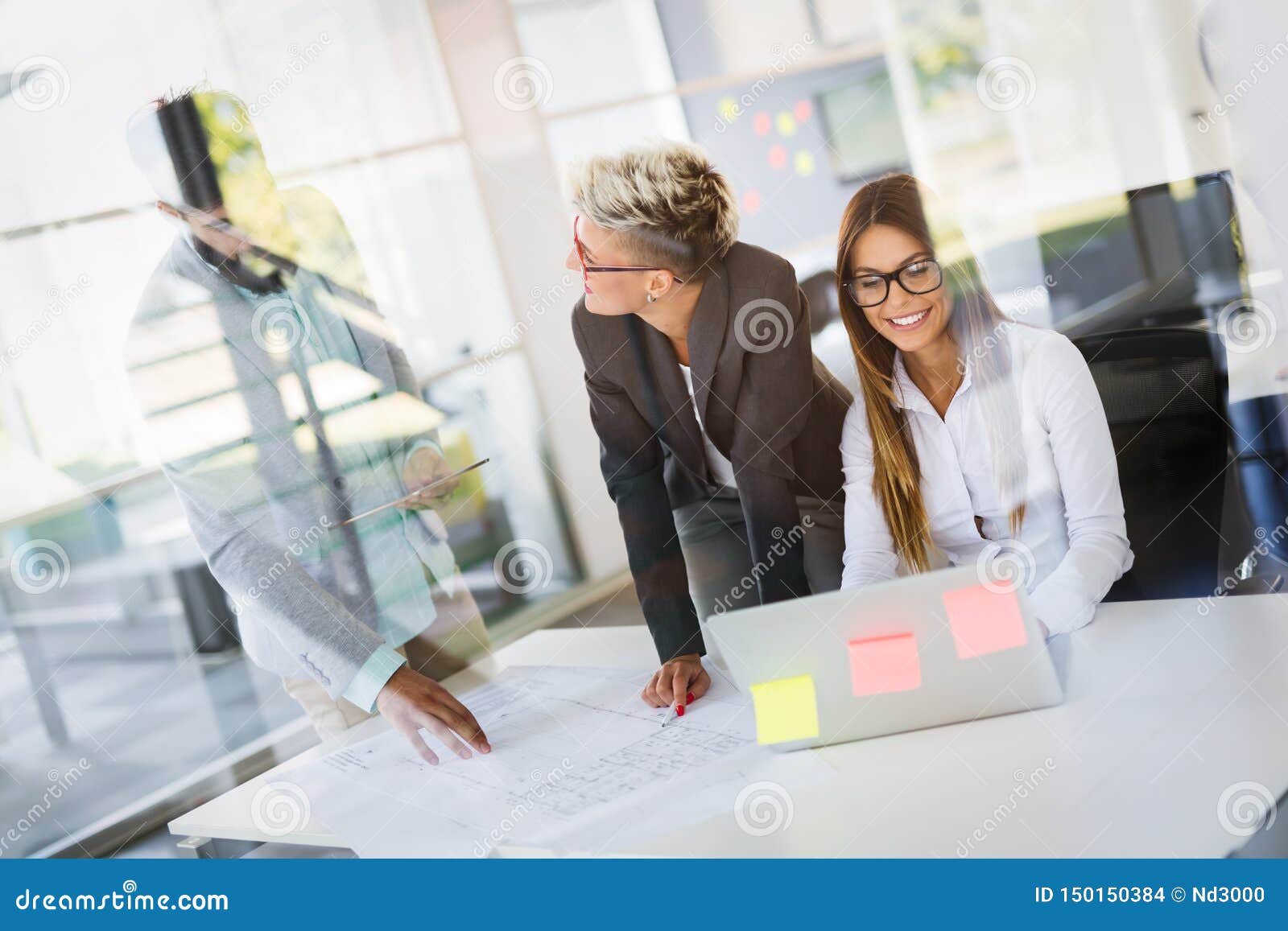 Picture of Young Architects Discussing in Office Stock Photo - Image of ...