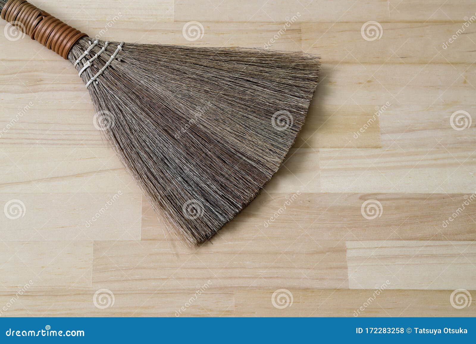 A hand broom on the floor stock photo. Image of hand - 172283258