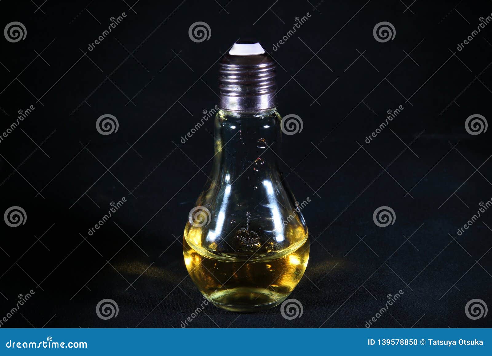 Water splash in light bulb stock photo. Image of lamp - 139578850