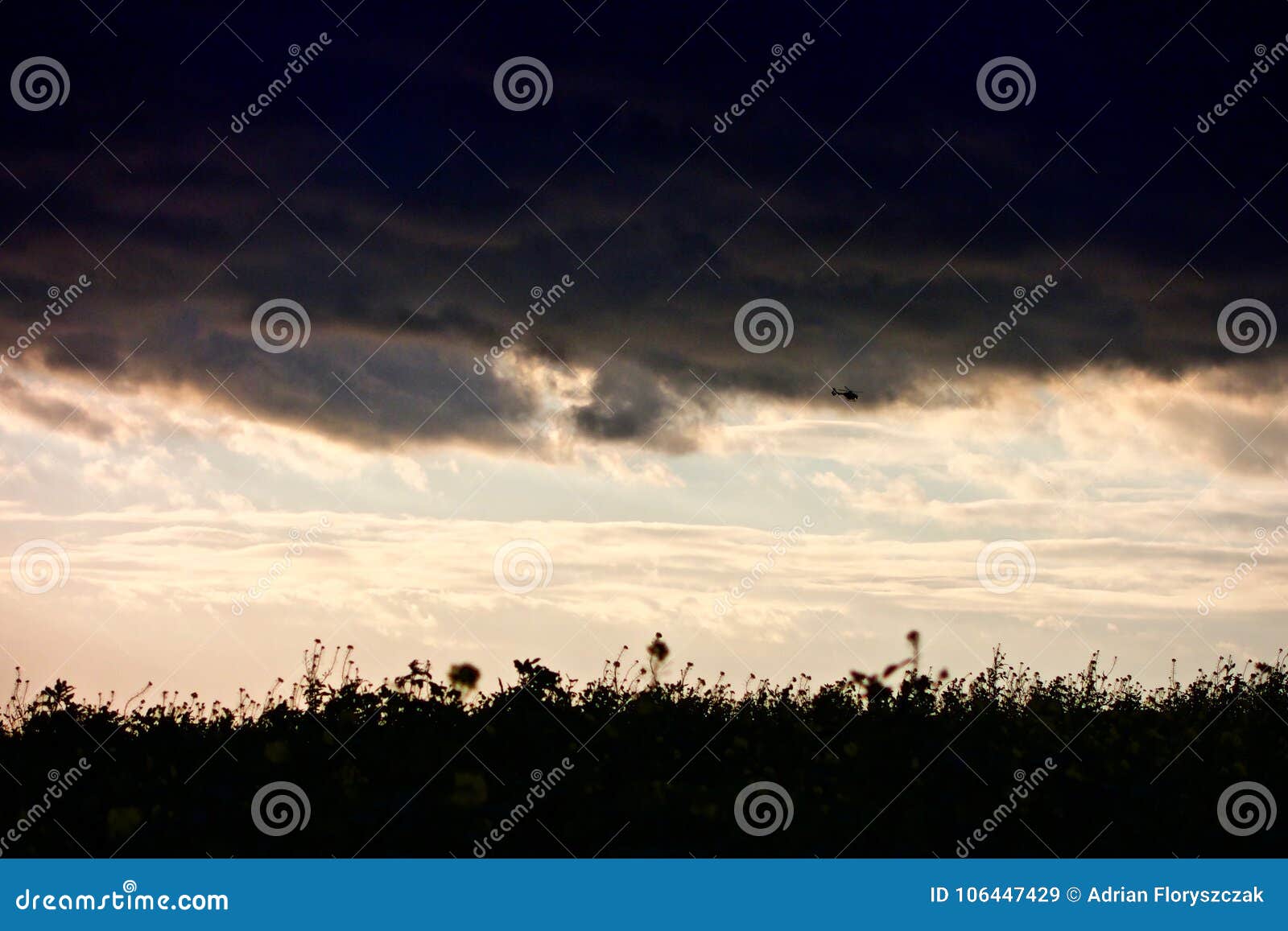 Dark Blue Brooding Sky after a Storm with a Helicopter in the Clouds ...