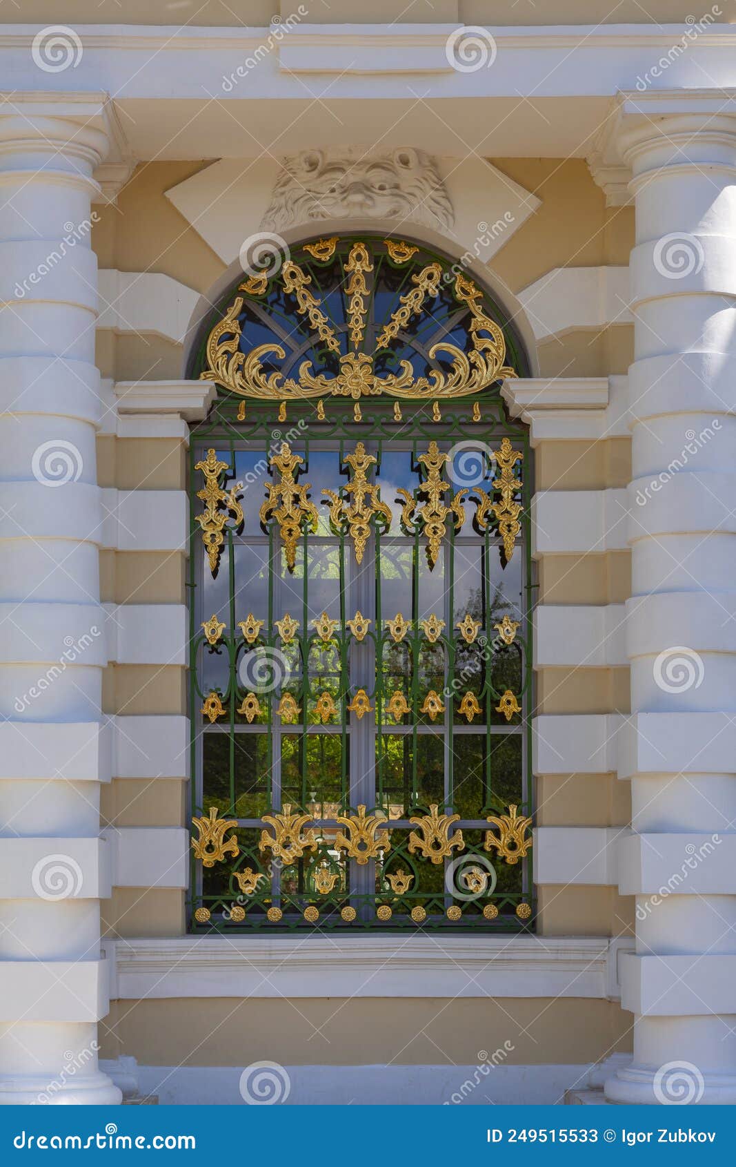 A Picturesque Window of an Old Mansion with Columns and a Gilded ...