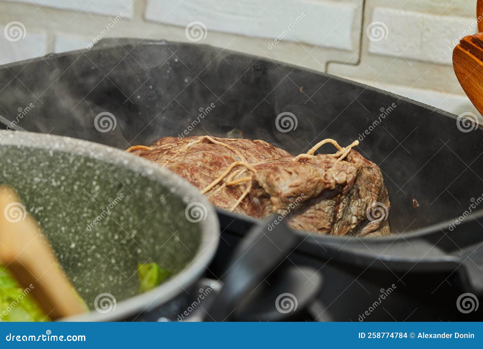 Piece of Beef Meat Being Fried in Rectangular Cooking Pot Over Fire on ...