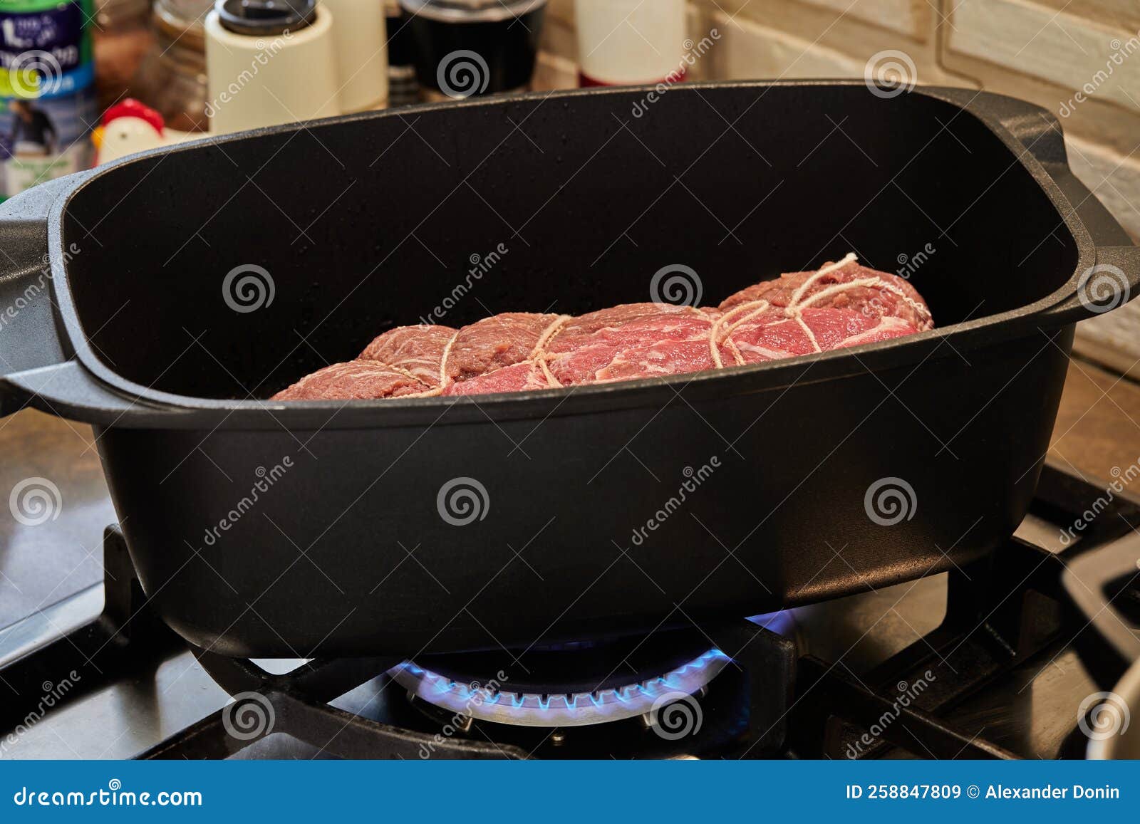Piece of Beef Meat Being Fried in Rectangular Cooking Pot Over Fire on ...