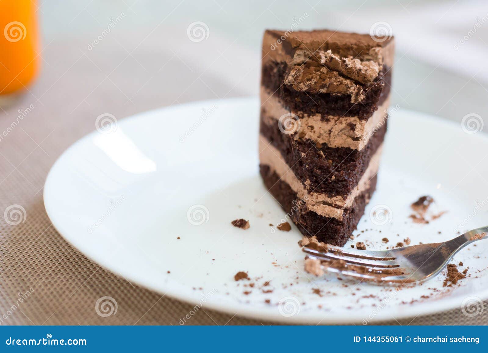 Piece of Chocolate Cake and Fork in the Dish on the Table Stock Image ...