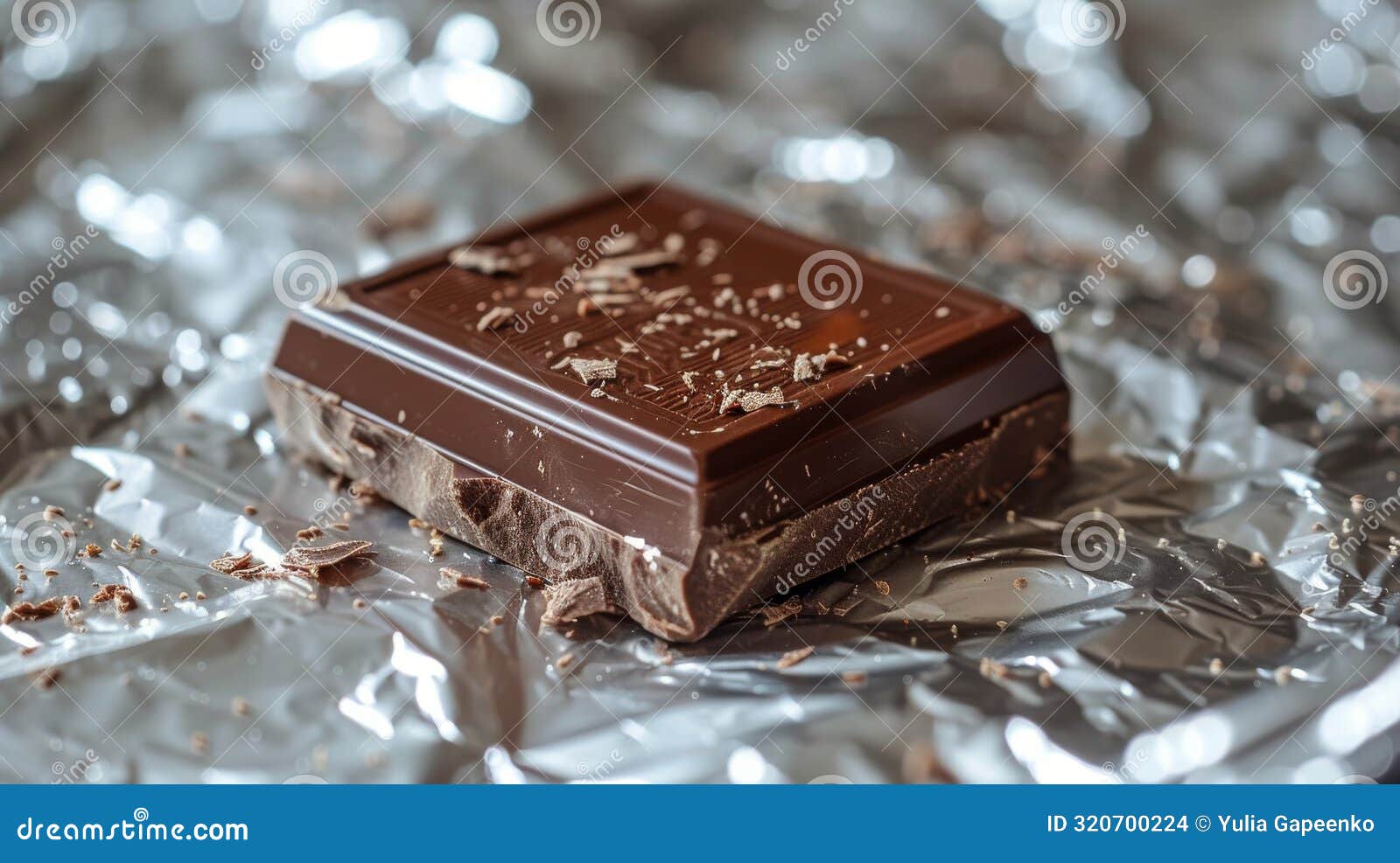 A Piece of Dark Chocolate on Silver Foil Wrapping Stock Photo - Image ...
