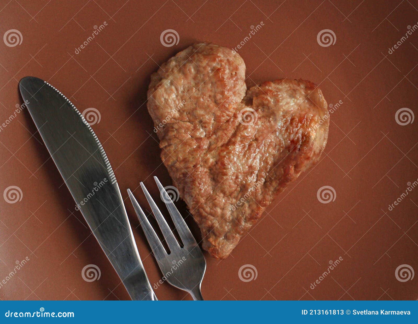 A Piece of Fried Pork Meat in the Shape of a Heart on a Plate Stock ...