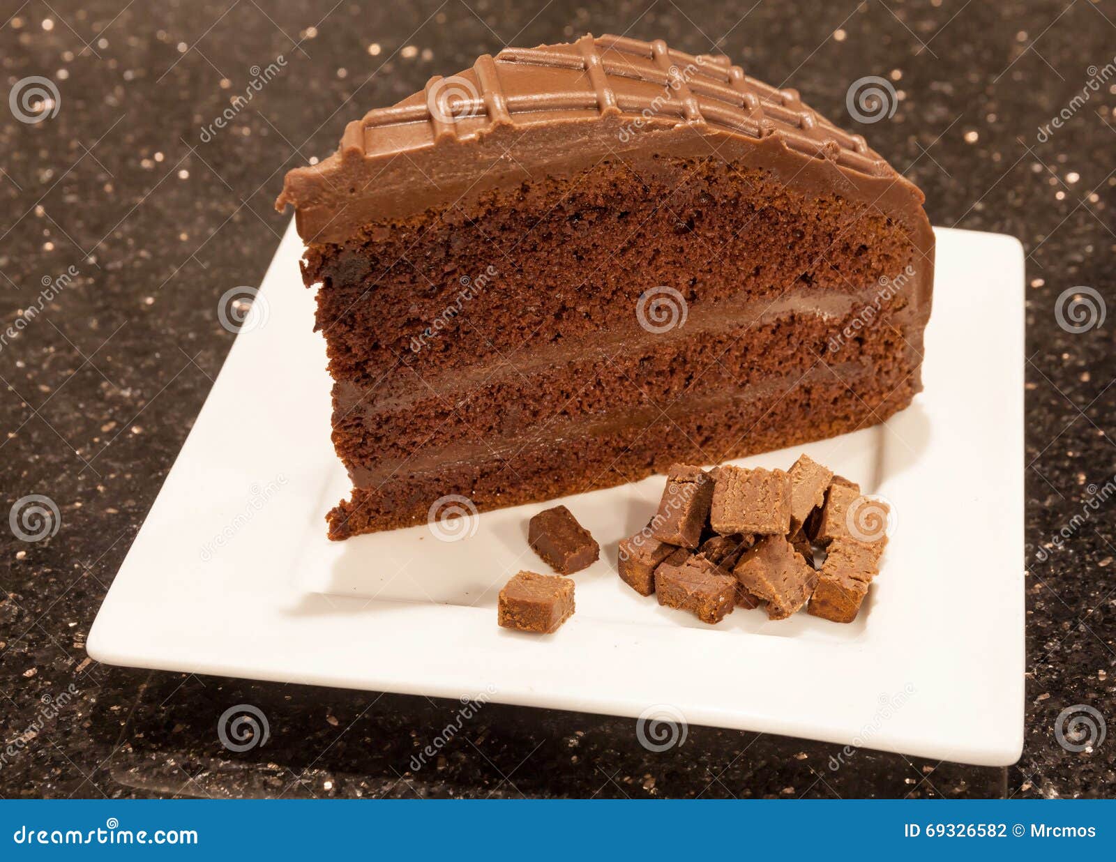 Piece of Frosting Chocolate Cake Served on White Square Plate. Stock ...
