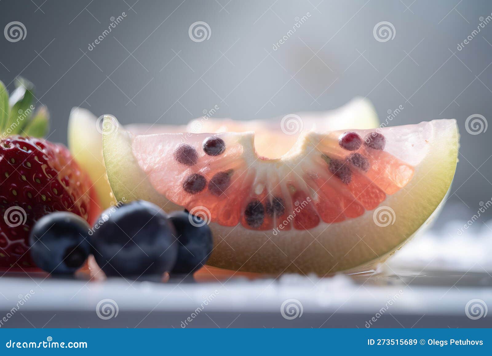 A Piece of Fruit is Cut in Half and Placed on a Plate Stock ...