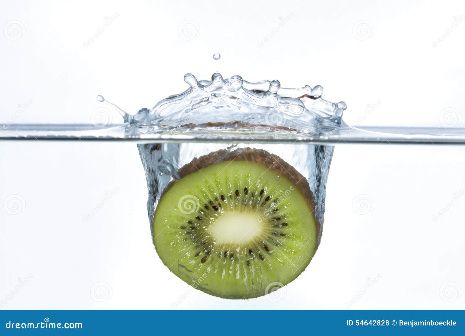 Piece of a Kiwi Falling into Water with a Splash Stock Photo - Image of ...