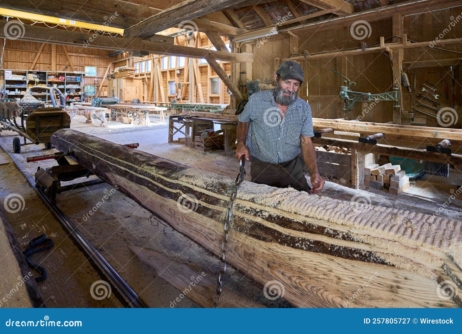 Piece Of A Log With Sawdust On It And A Man Working In An Old Sawmill Stock Image Image Of