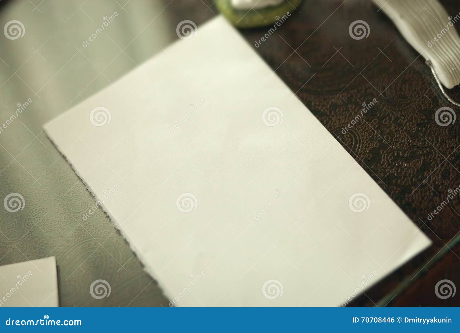 Piece of Paper Lying on Table Under Warm Sunset Light. Stock Photo ...