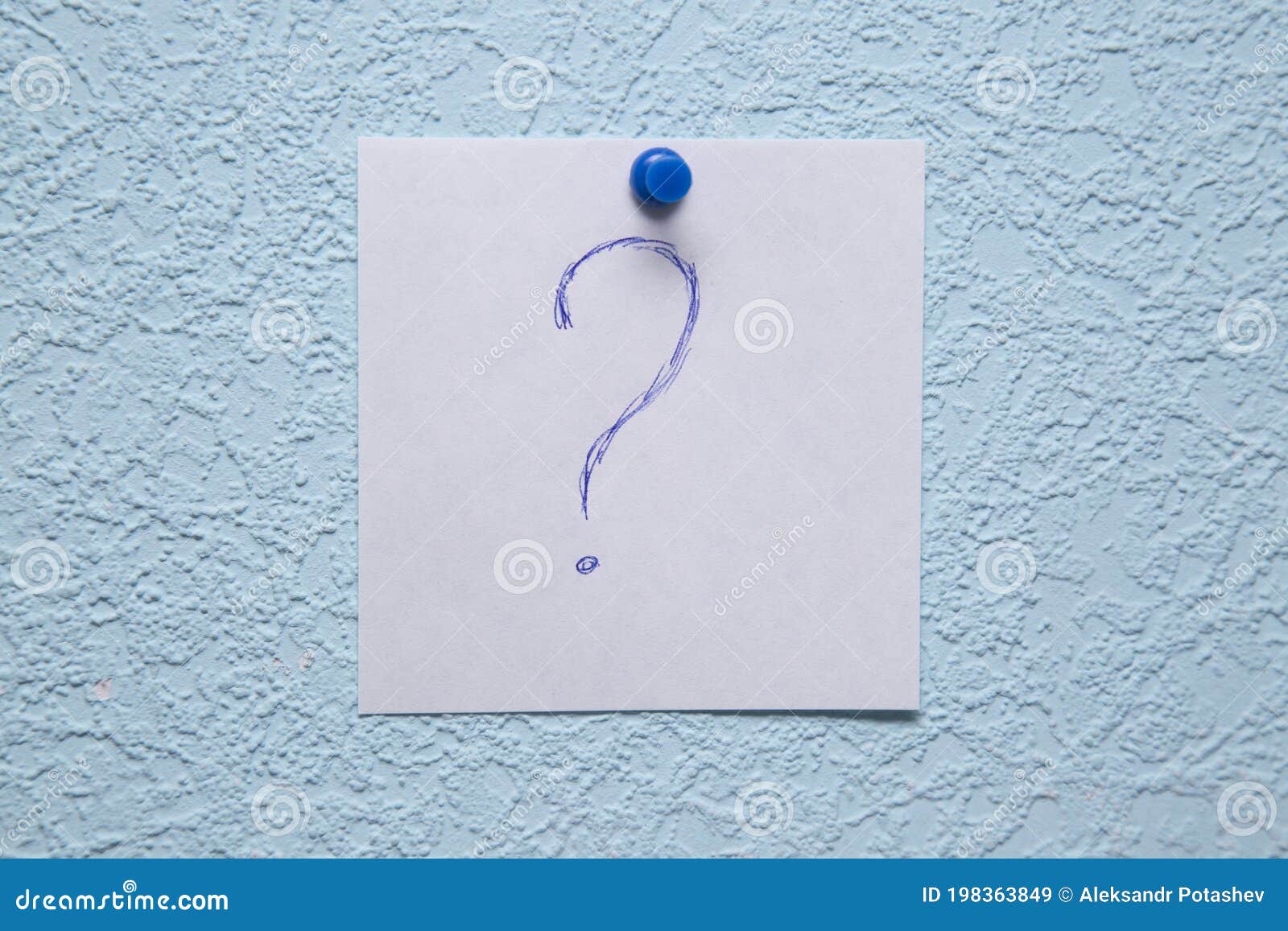 A Piece of Paper with a Question Mark in the Office is Attached To the ...