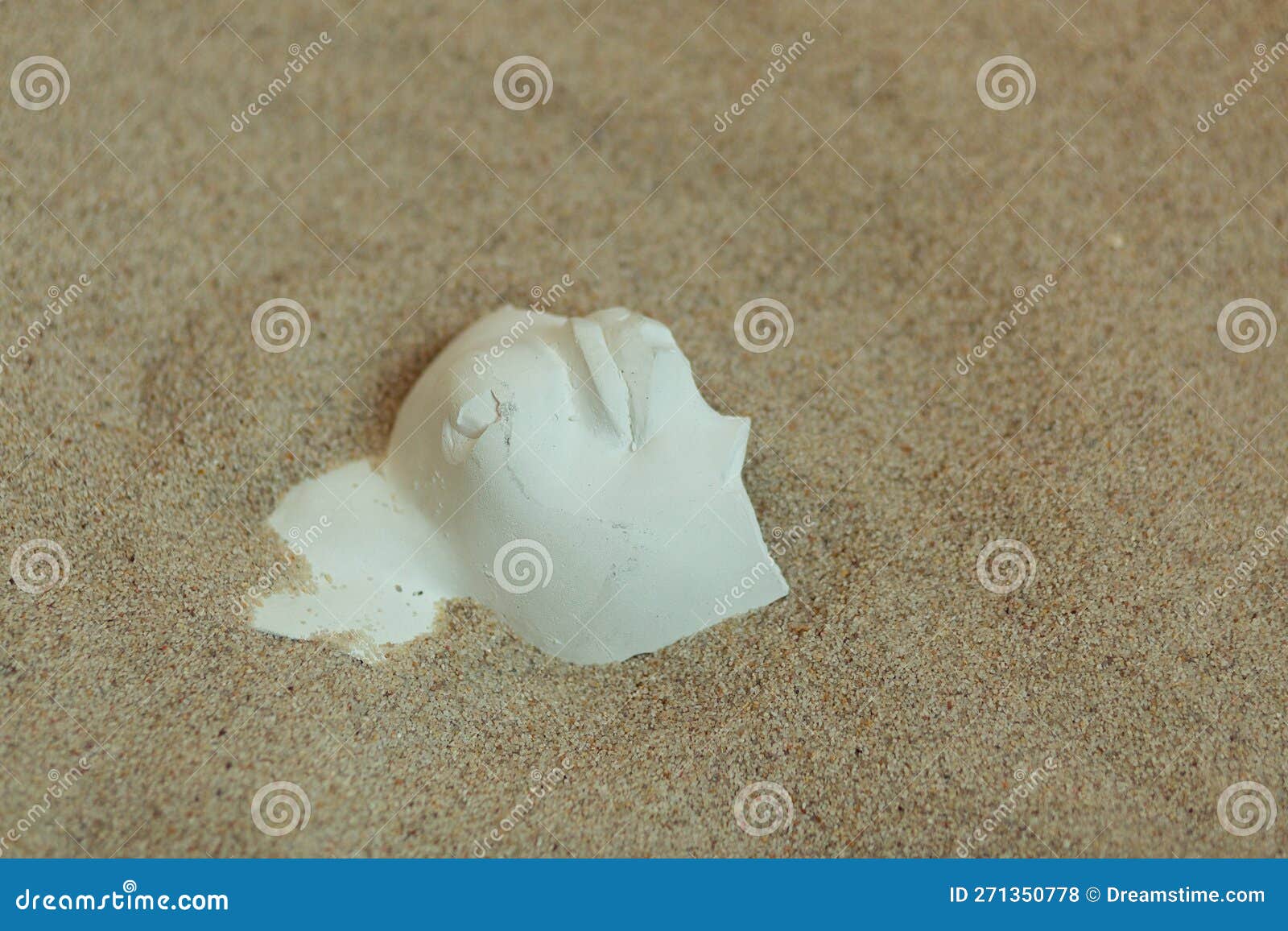 A Piece of Plaster Face Sculpture in the Sand. Stock Photo - Image of ...