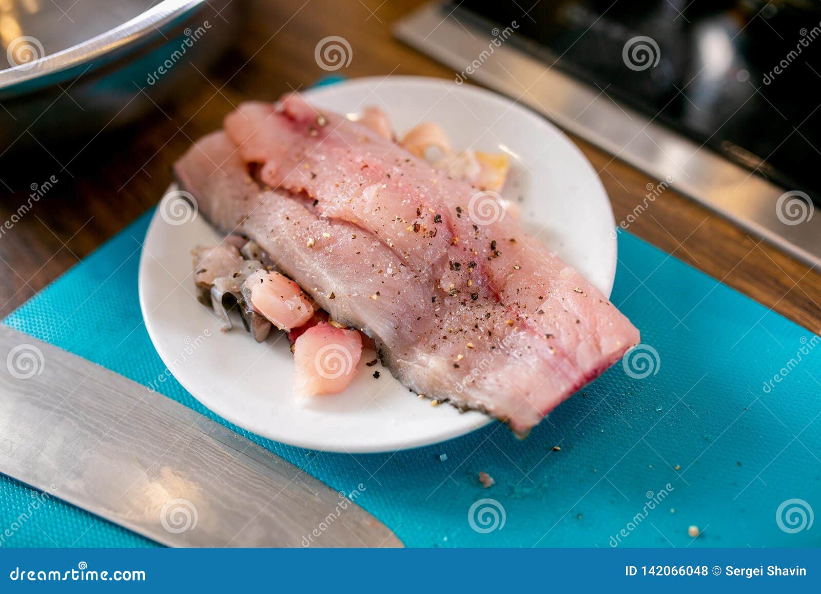 Piece of Raw Fish with Spices on a Plate. Master Class in the Kitchen ...