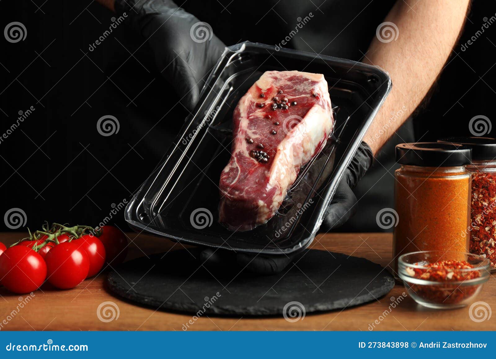 A Piece of Raw Fresh Meat Vacuum-packed in the Hands of a Cook on a ...