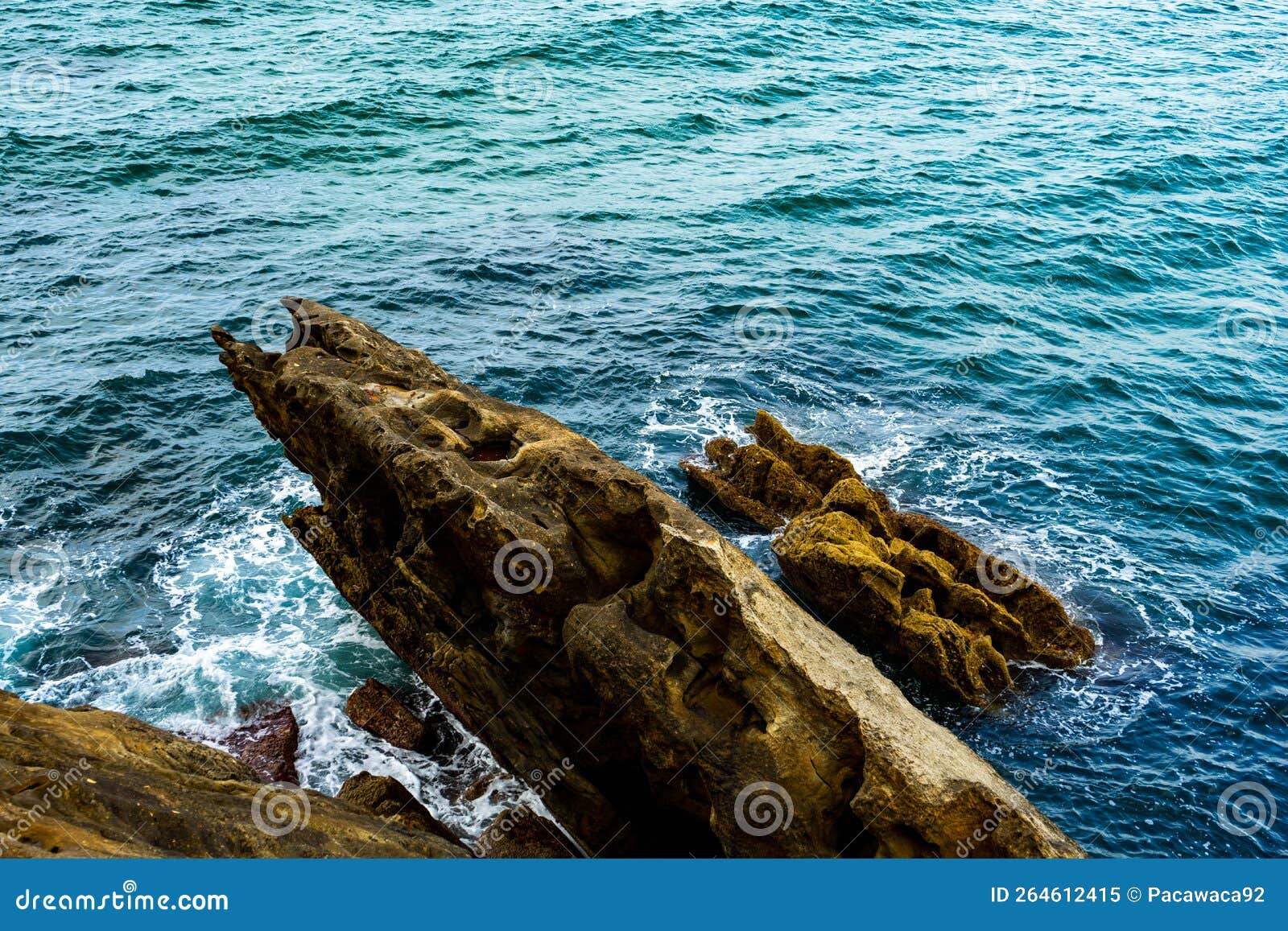 Rock Sticking Out Of The Sea Surface With Mountain Coast And Boat In ...