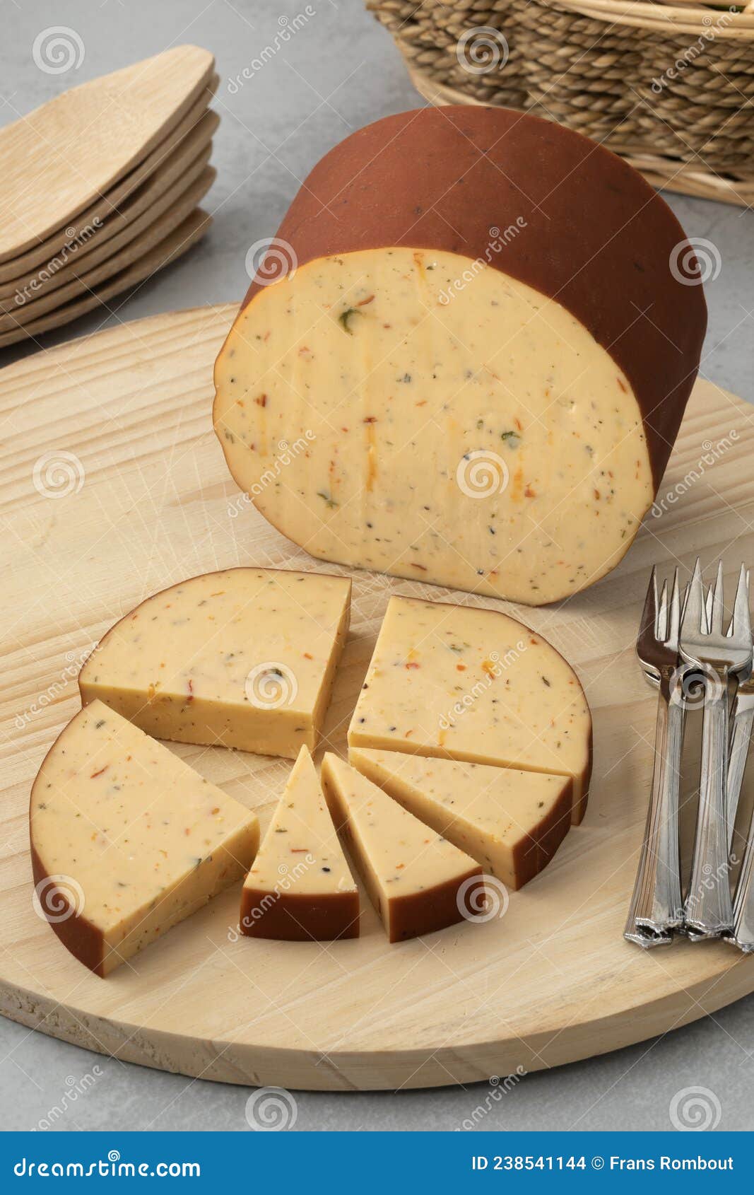 Piece and Slice of Dutch Smoked Cheese with a Mixture of Herbs Stock ...