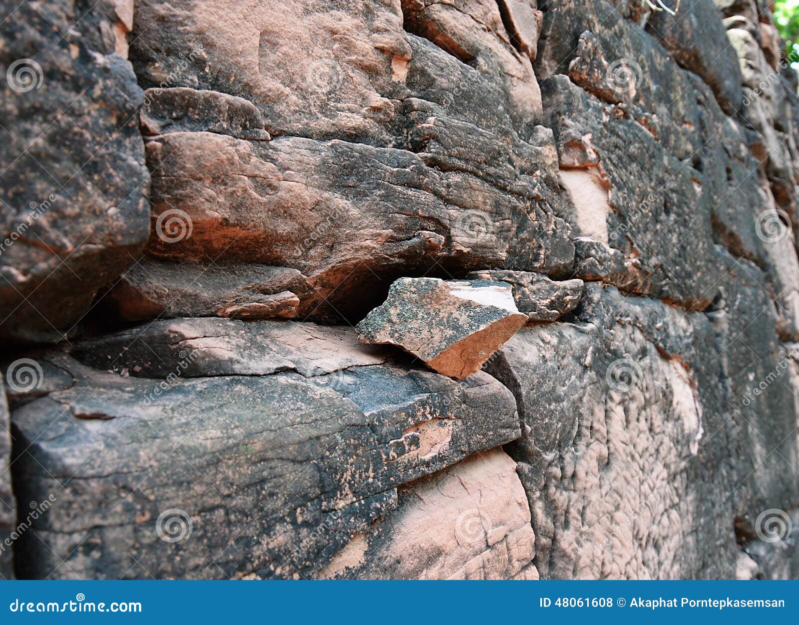 Piece of Triangle Ancient Rock on the Wall Stock Photo - Image of ...