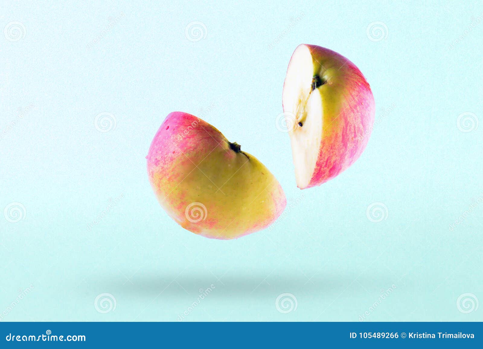 Pieces of an Apple in Flight on a White Background, Isolated. Half of ...