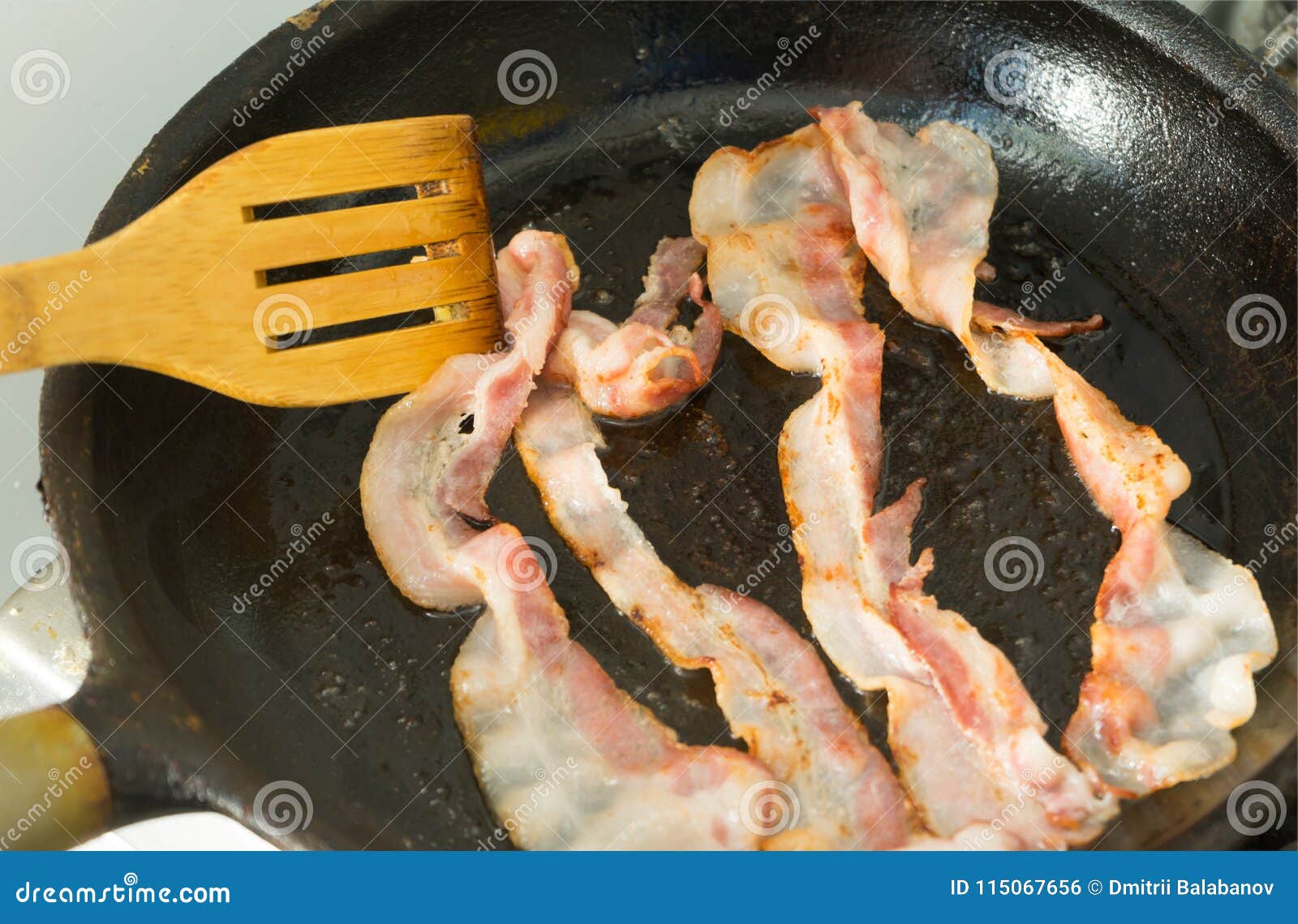 Pieces of Bacon are Fried in a Pan. Preparation of Breakfast Stock ...