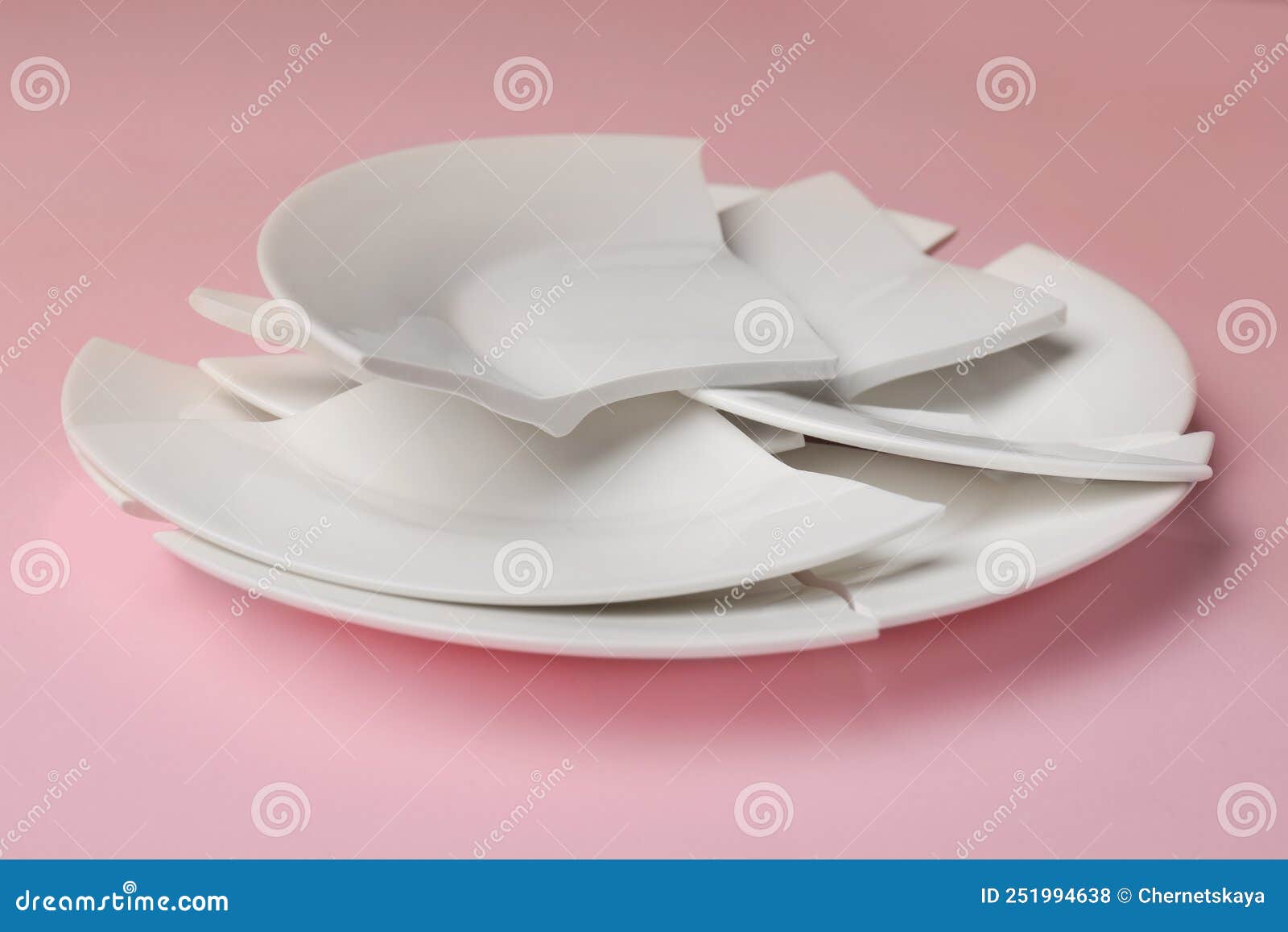 Pieces of Broken Ceramic Plate on Pink Background, Closeup Stock Photo ...