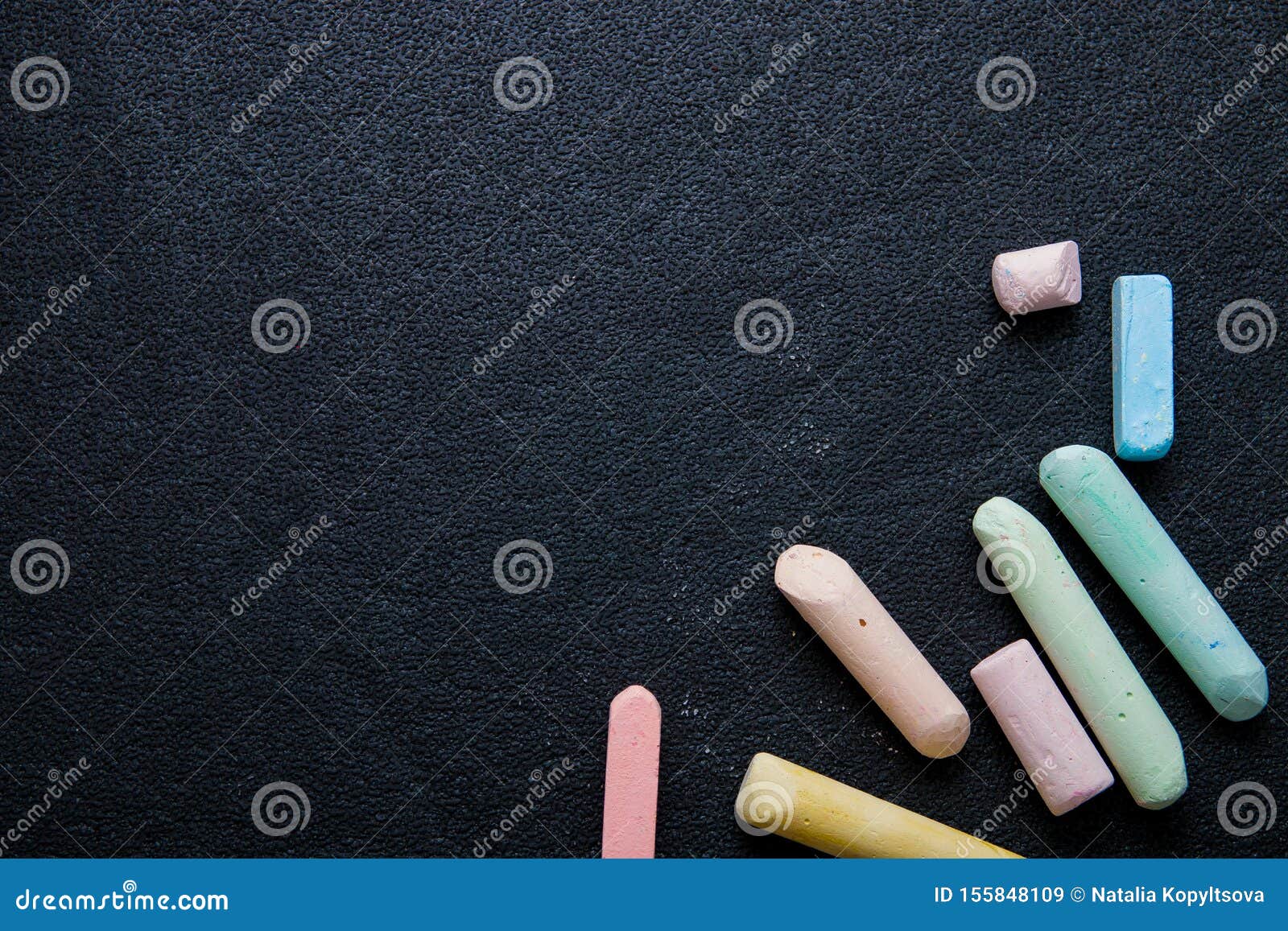 Pieces of Chalk on a Black Rubber Background, Copy Space, Top View ...