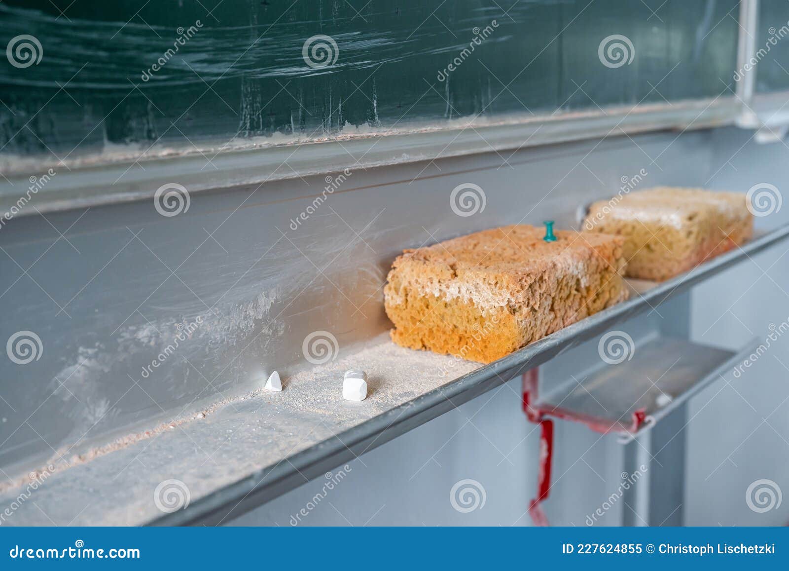 Pieces of Chalk and Blackboard Duster on Green Background, Top View ... Pieces of Chalk and Blackboard Duster on Green Background, Top View ...