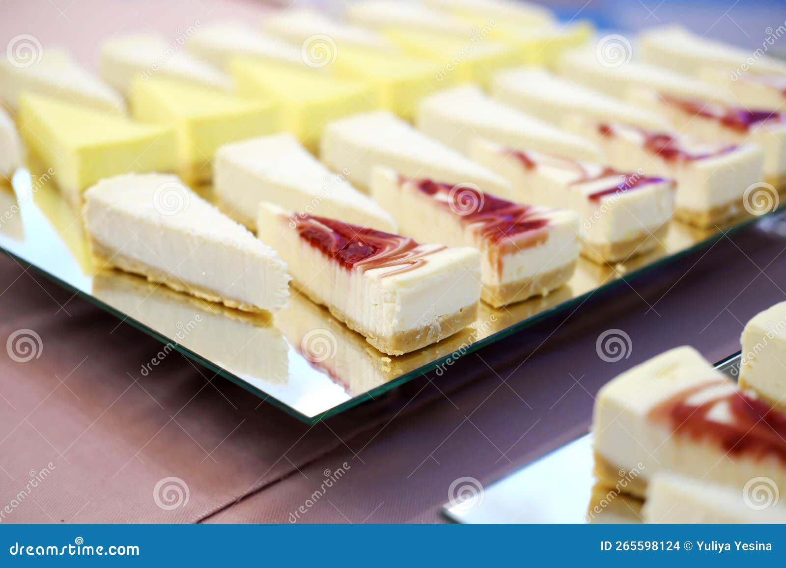 Pieces of Cheesecakes on a Mirrored Tray on the Buffet Table Stock ...