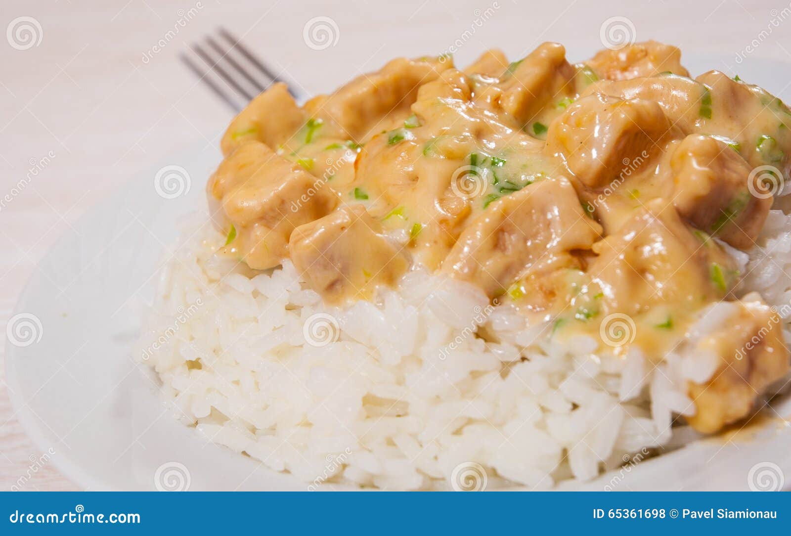 Pieces of Chicken Fillet and Cheese Sauce with Rice Stock Photo - Image ...