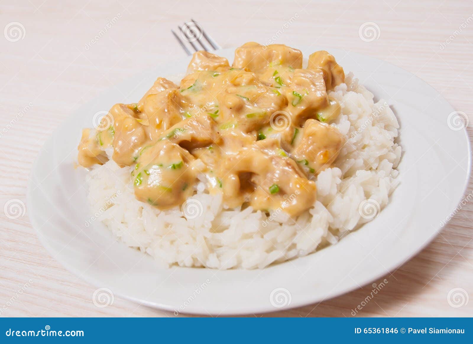Pieces of Chicken Fillet and Cheese Sauce with Rice Stock Photo - Image ...