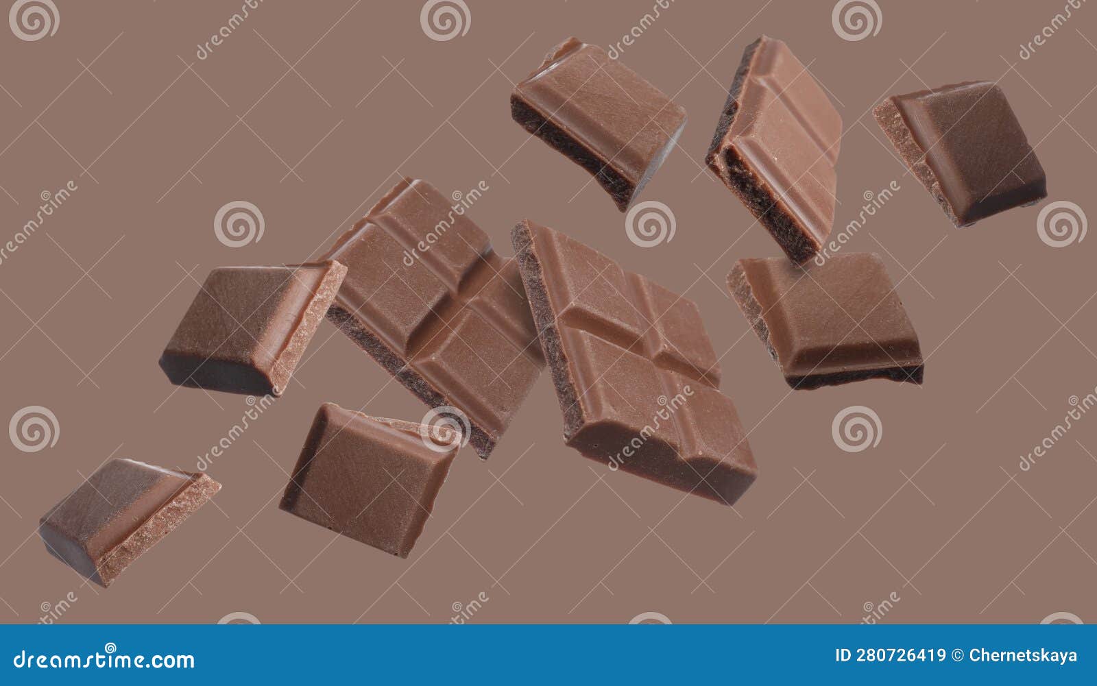Pieces of Chocolate Bar Falling on Brown Background Stock Image - Image ...