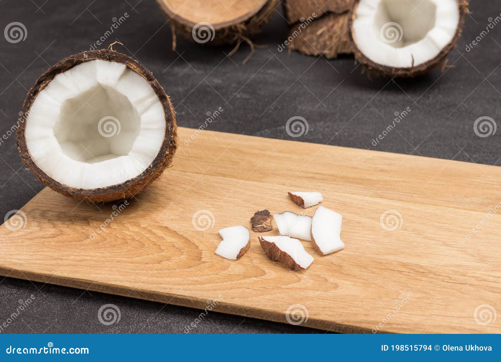 Pieces of Coconut and Half of Coconut on Board Stock Photo - Image of ...