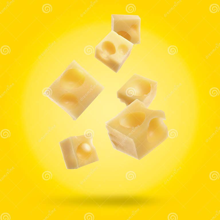 Pieces of Delicious Cheese Falling on Yellow Stock Photo - Image of ...