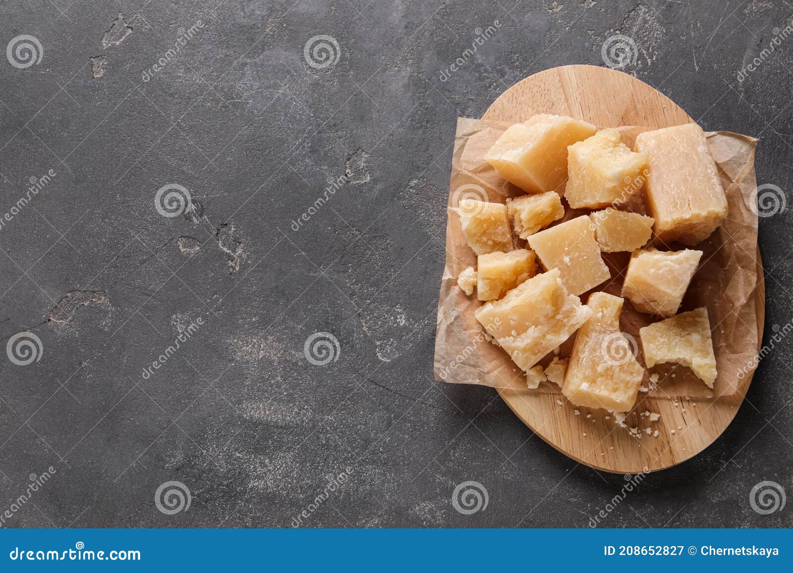 Pieces of Delicious Parmesan Cheese on Grey Table, Top View. Space for ...