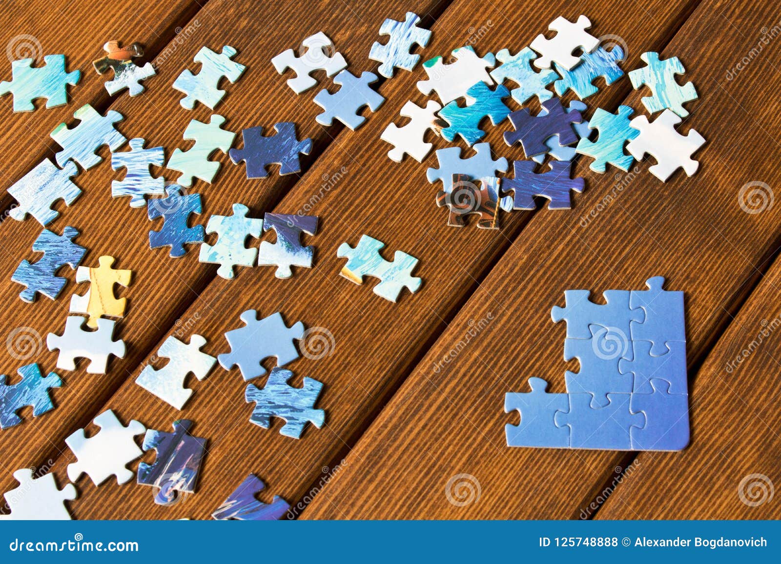 Pieces of Different Puzzles on a Wooden Table. the Concept of Th Stock ...