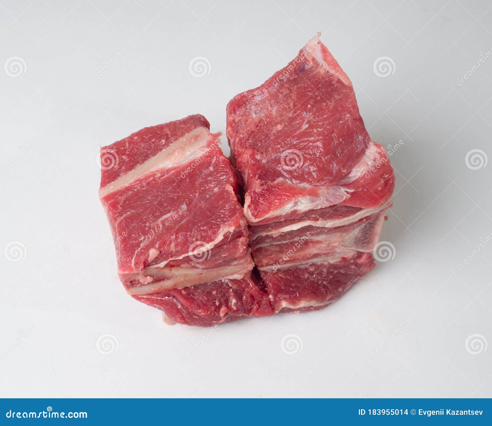 Pieces of Fresh Raw Meat and Beef Bones on a White Background Stock ...