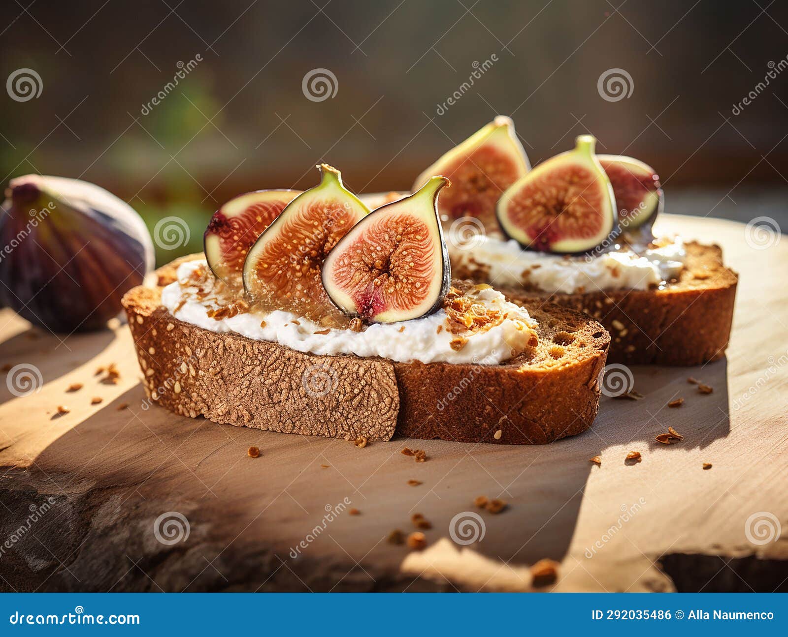 Pieces of Glazed Figs on a Piece of Bread Spread with Cream Cheese ...