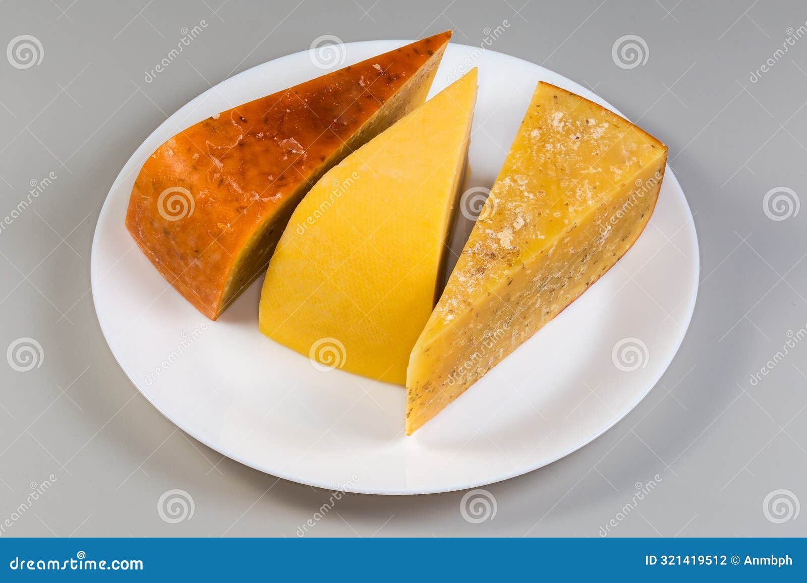 Pieces of Hard Cheese on Dish on a Gray Background Stock Photo - Image ...