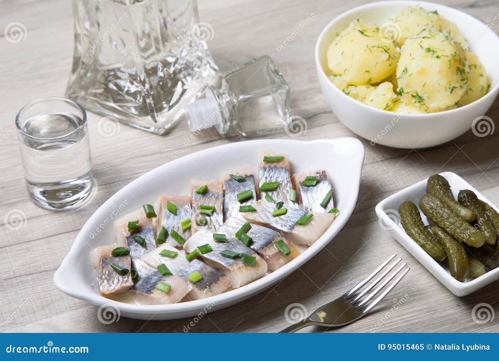 Pieces of Herring with Onions, Gherkins, Boiled Potatoes and Vodka ...