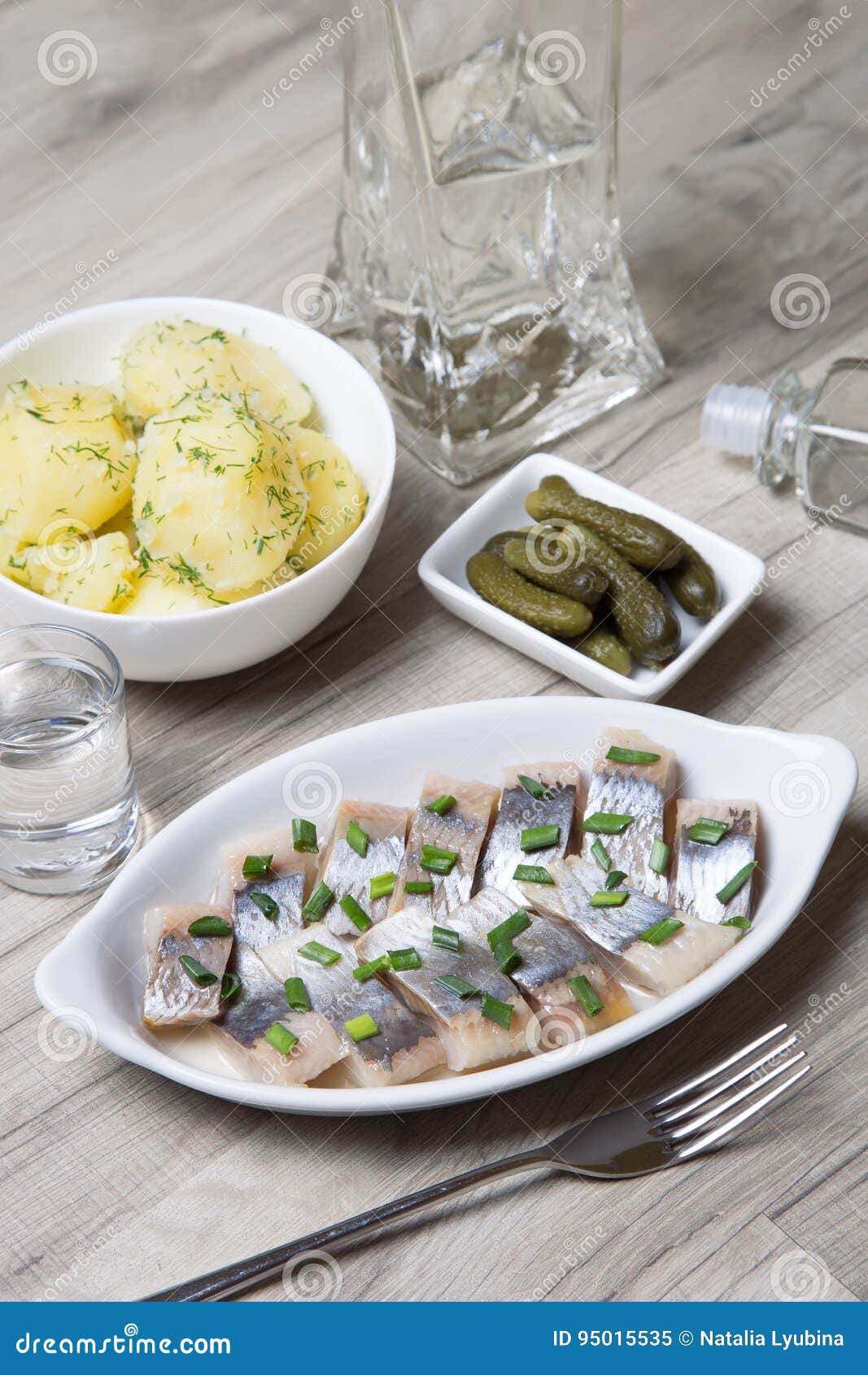 Pieces of Herring with Onions, Gherkins, Boiled Potatoes and Vodka ...