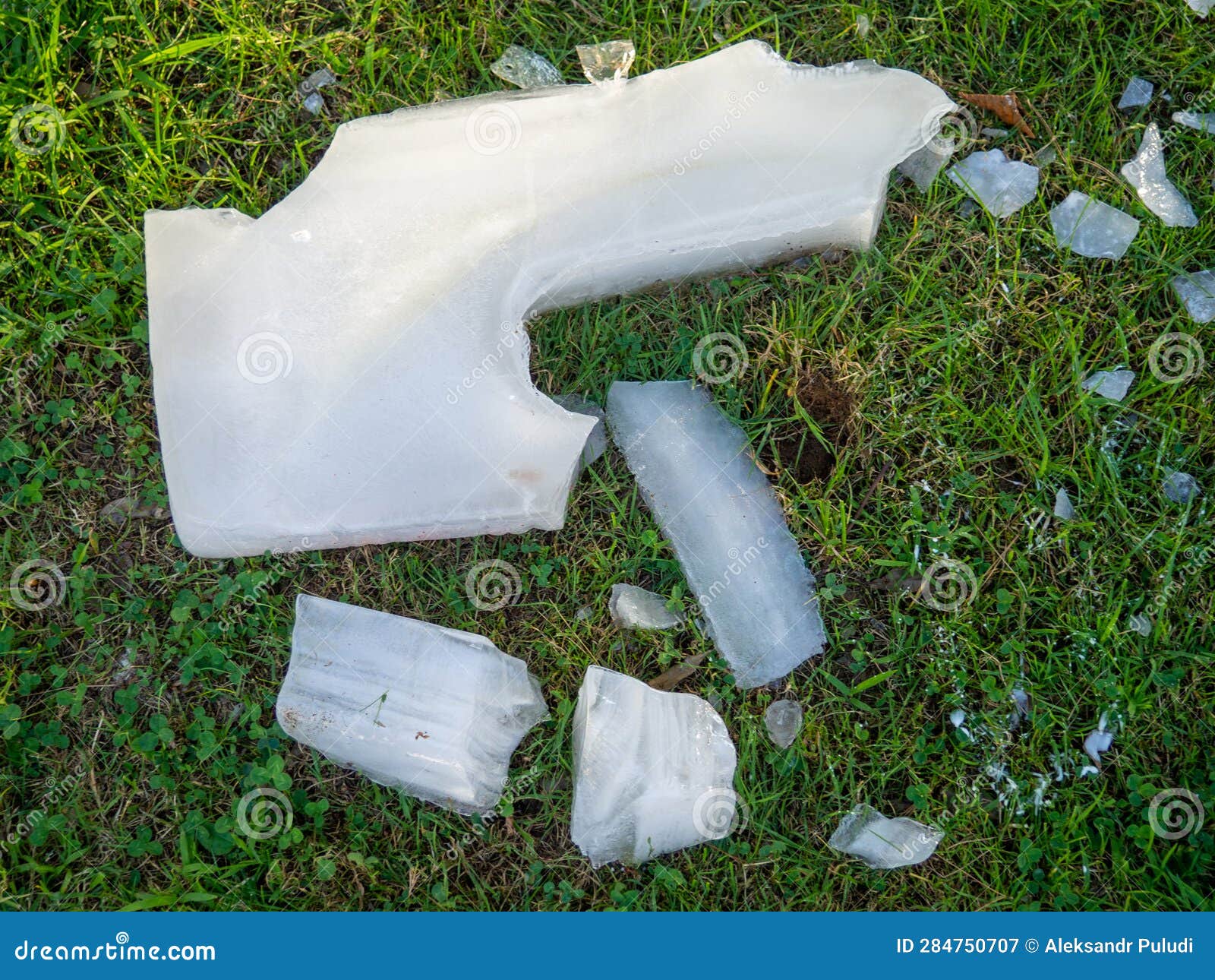 Pieces of Ice on the Grass. Discarded Ice Stock Image - Image of grass ...
