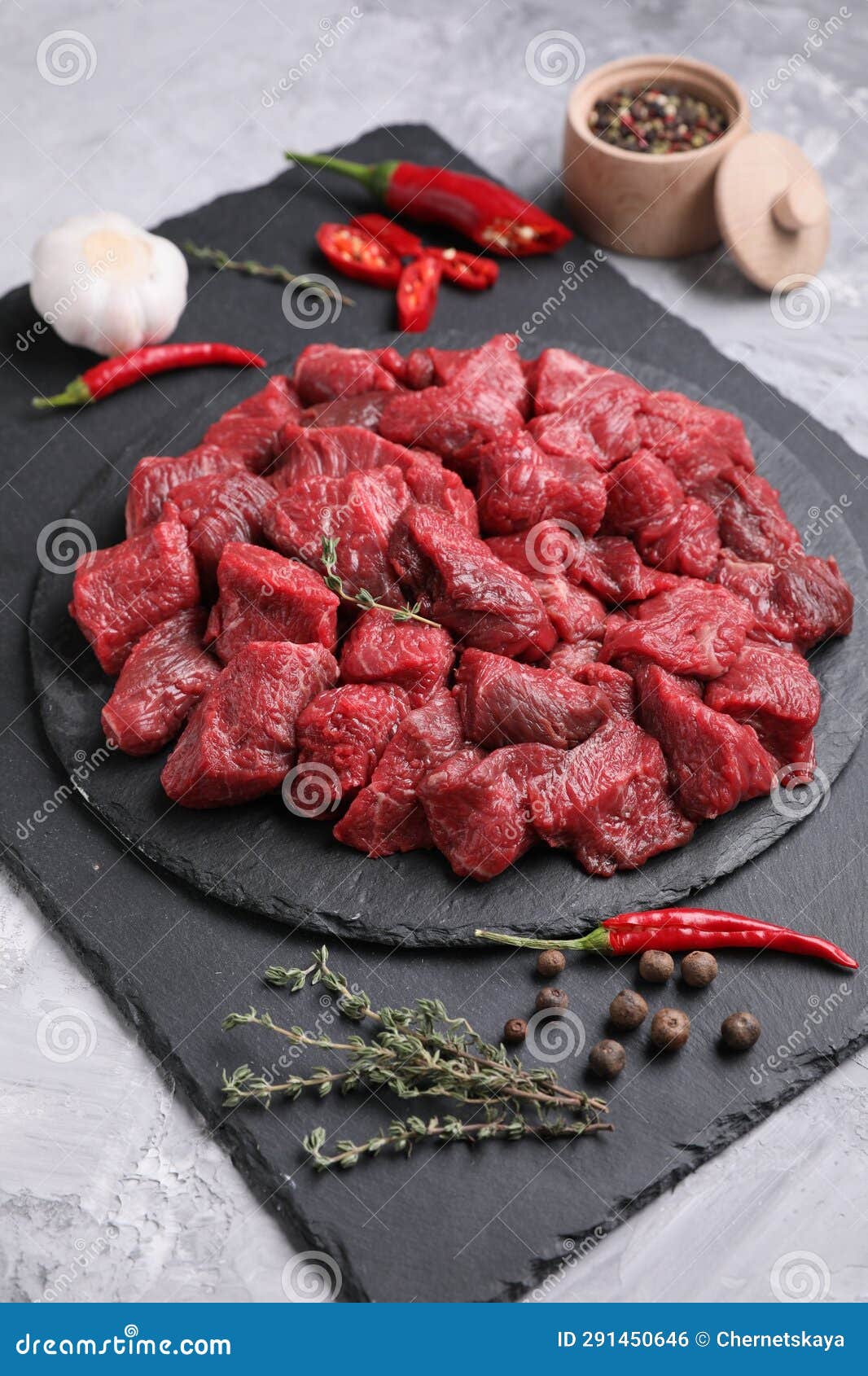 Pieces of Raw Beef Meat, Products and Spices on Grey Textured Table ...
