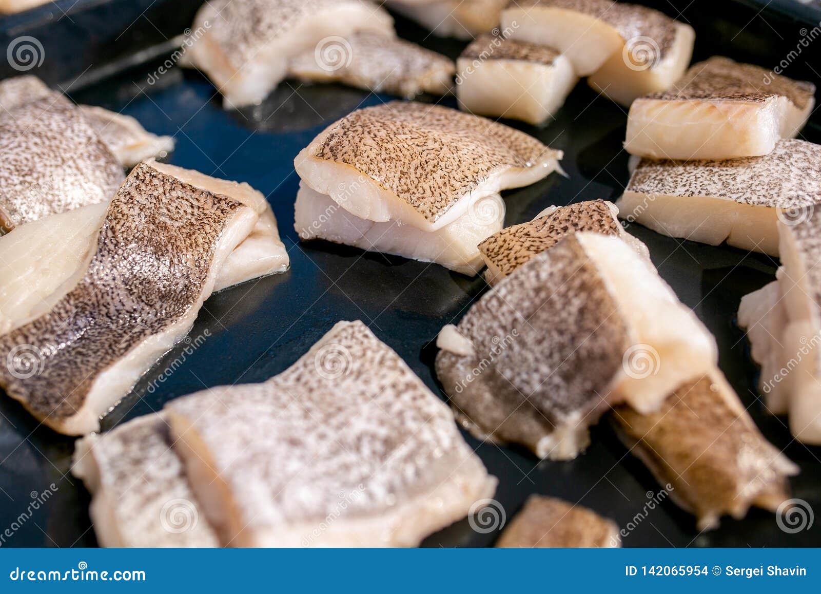 Pieces of Raw Fish on a Baking Sheet. Master Class in the Kitchen. the ...