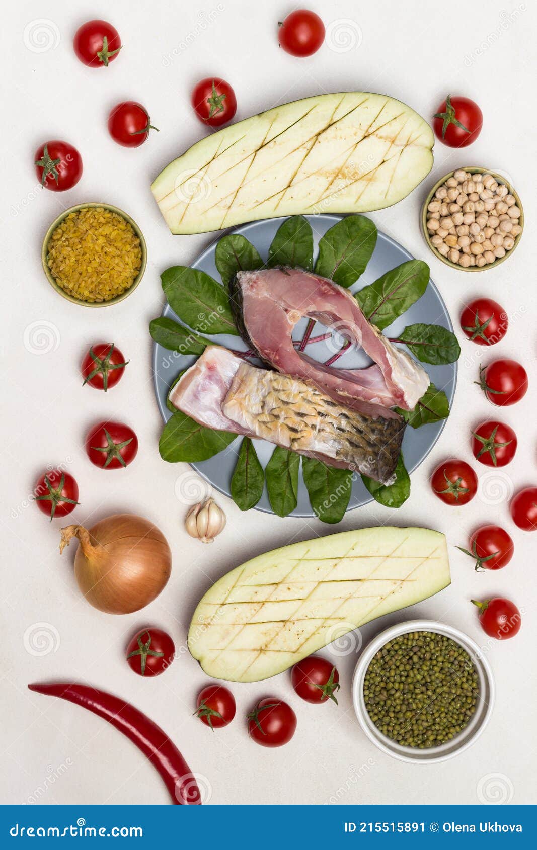Pieces of River Carp Fish in Plate. Eggplant, Tomatoes and Groats on ...