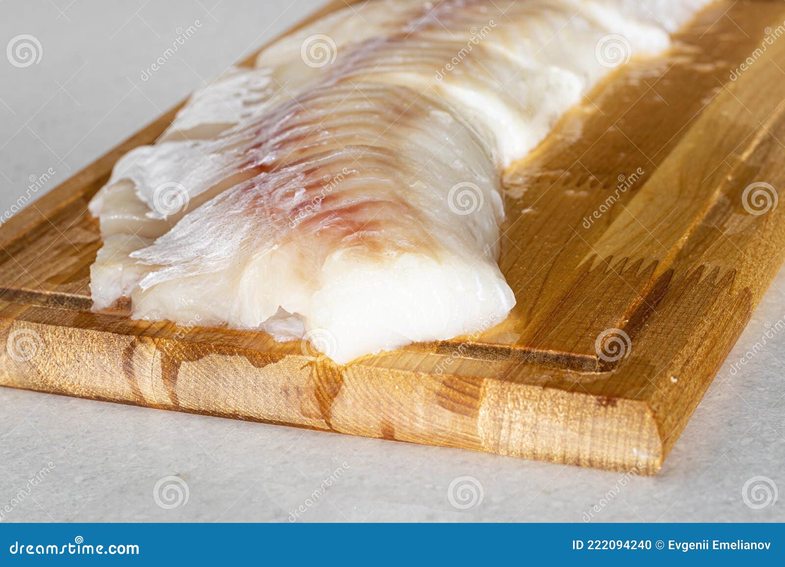 Pieces of Sliced Fish on a Wooden Cutting Board Stock Photo - Image of ...