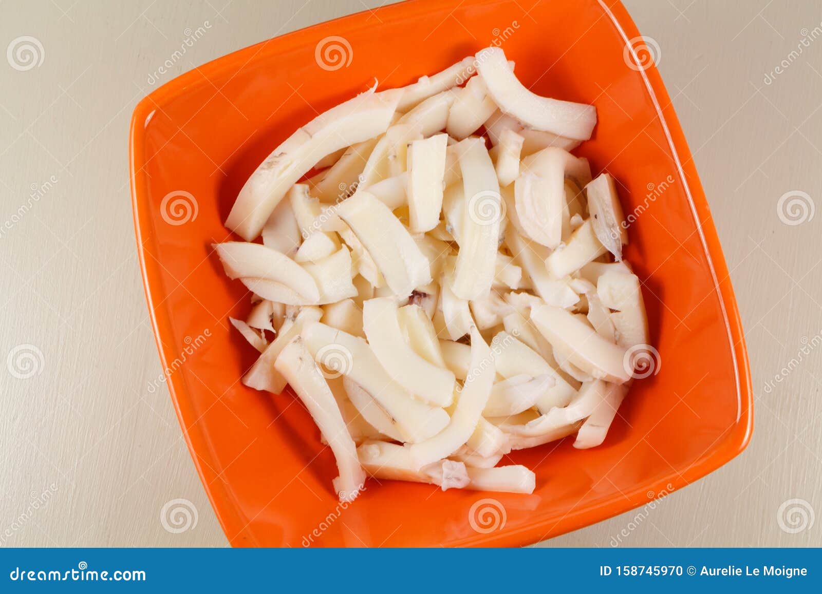 Pieces of squid in a bowl stock photo. Image of marine - 158745970